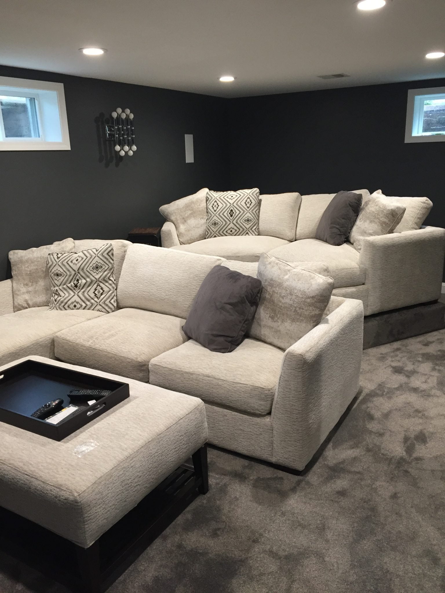 Designing a media wall sports room with multiple TVs and surround sound.